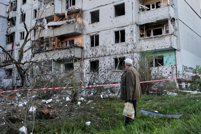 Russian attack on Ukraine capital kills at least 3 and traps others in ...