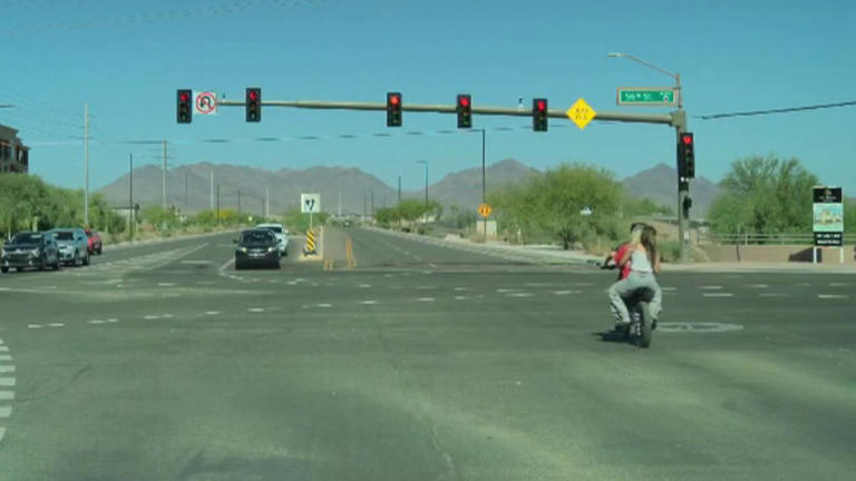 North Phoenix e-bike riders nearly hit by car after running red light