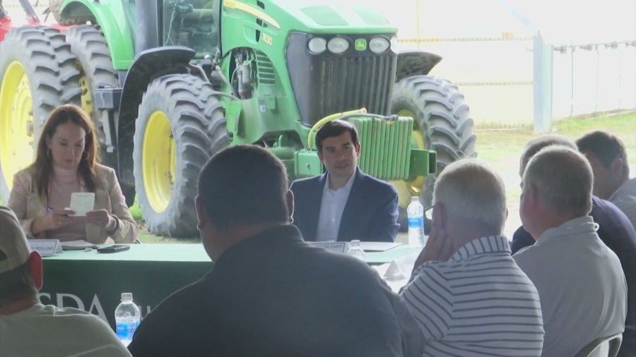 Farmers gather with two cabinet members to discuss protecting agriculture