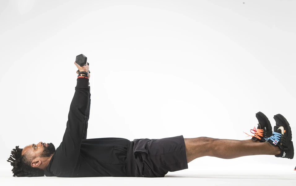 Beginner dumbbell abs workout focuses on mobility and control