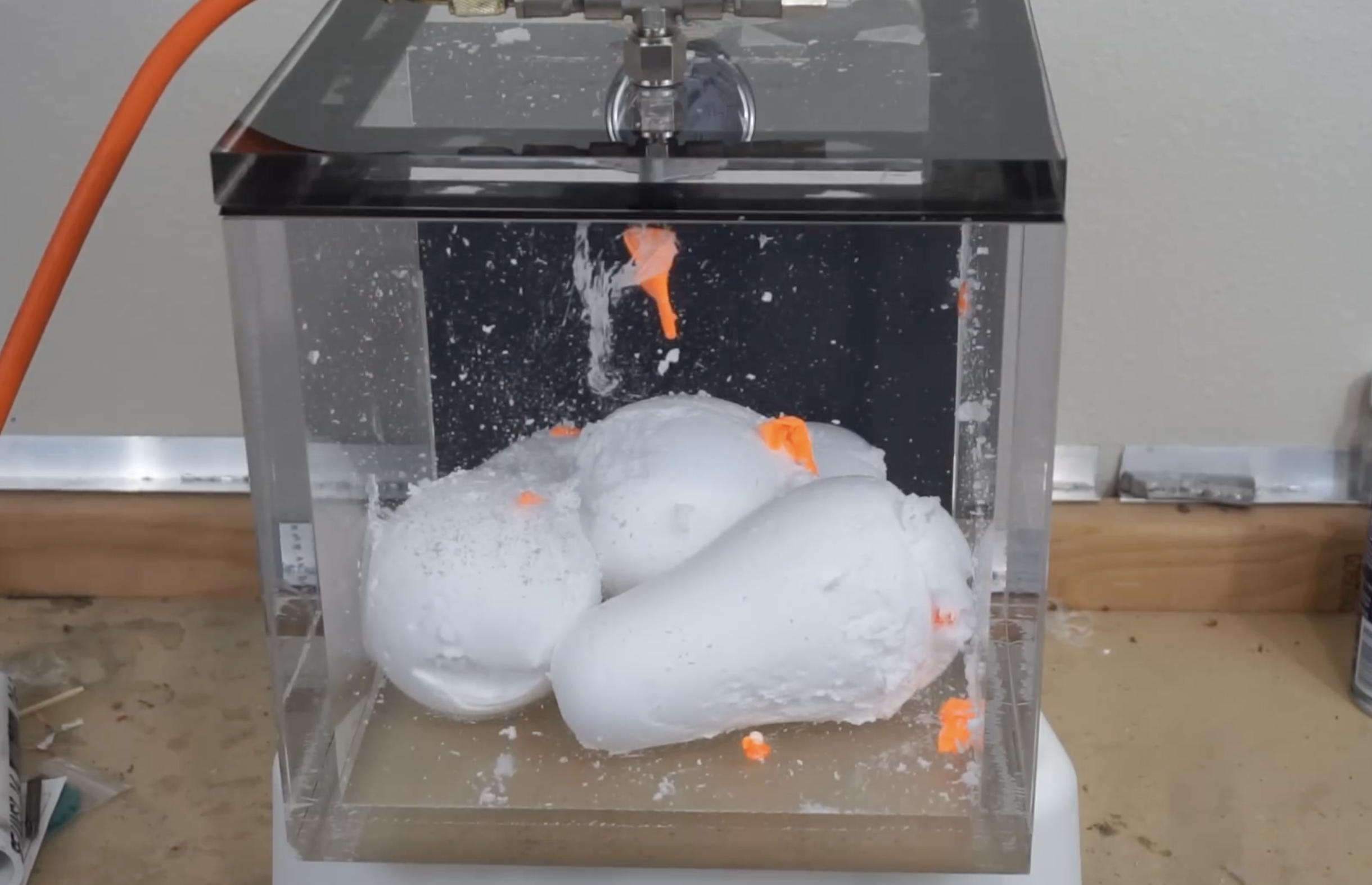 What happens when you put shaving cream balloons in a huge vacuum chamber?