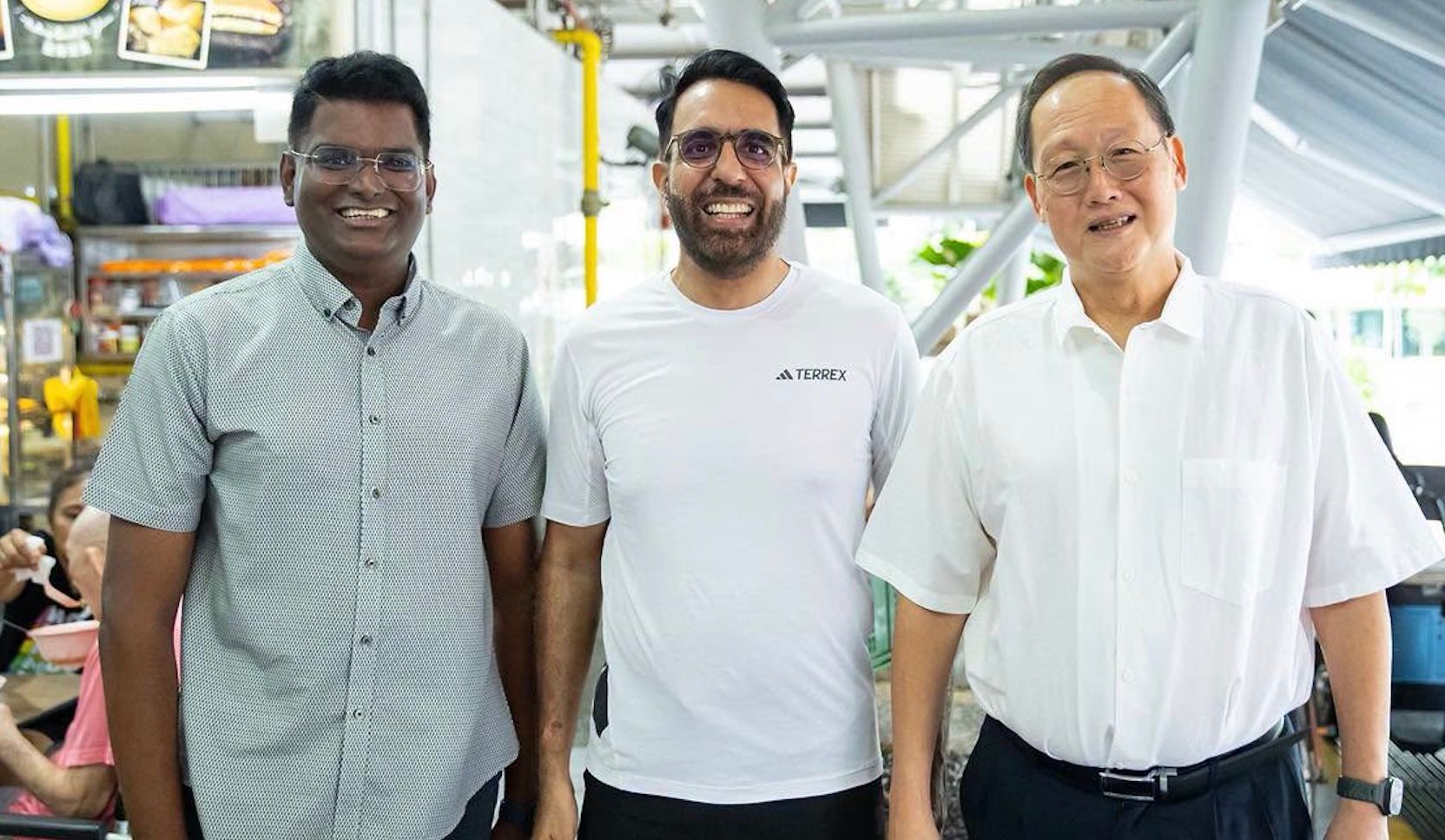 Pritam Singh greets Tan See Leng, grassroots adviser, at Eunos hawker ...