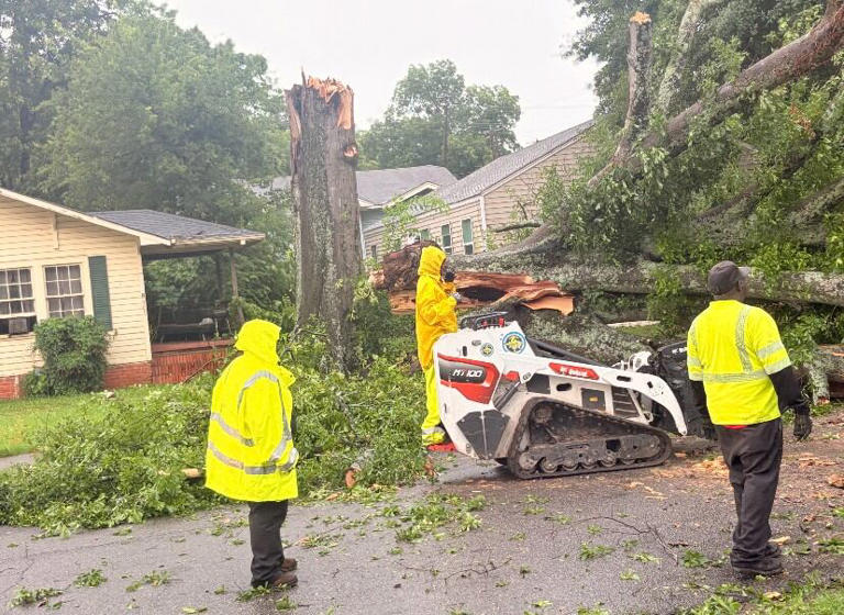 Downed trees block roads, damage homes and cars after storm sweeps ...