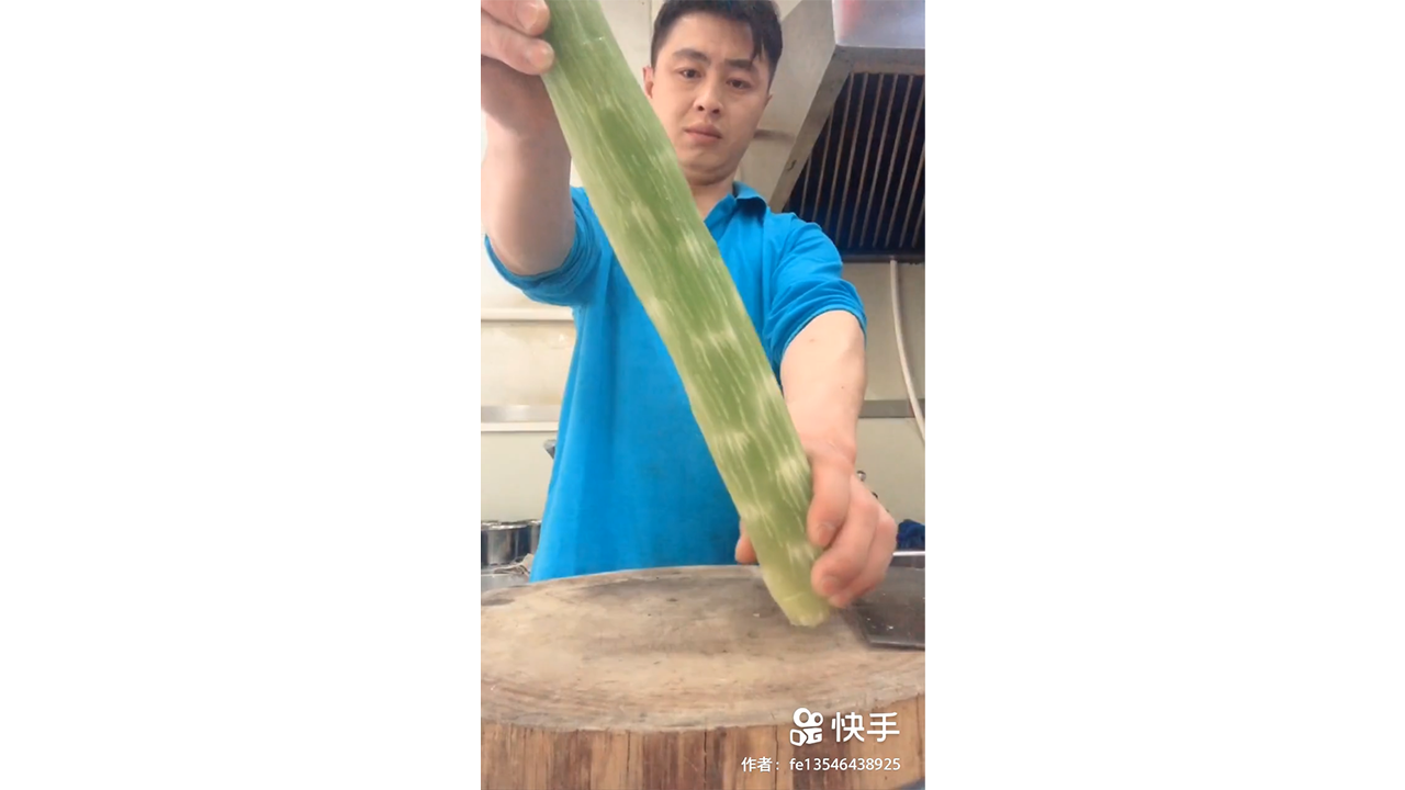 Peeling long luffa gourd into thin strips creating smooth and ...