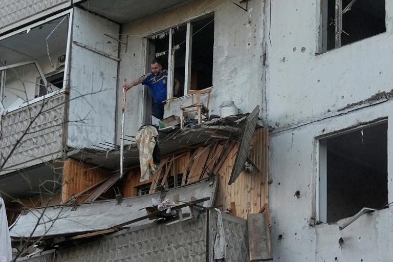 Russian attack on Ukraine capital kills at least 3 and traps others in ...