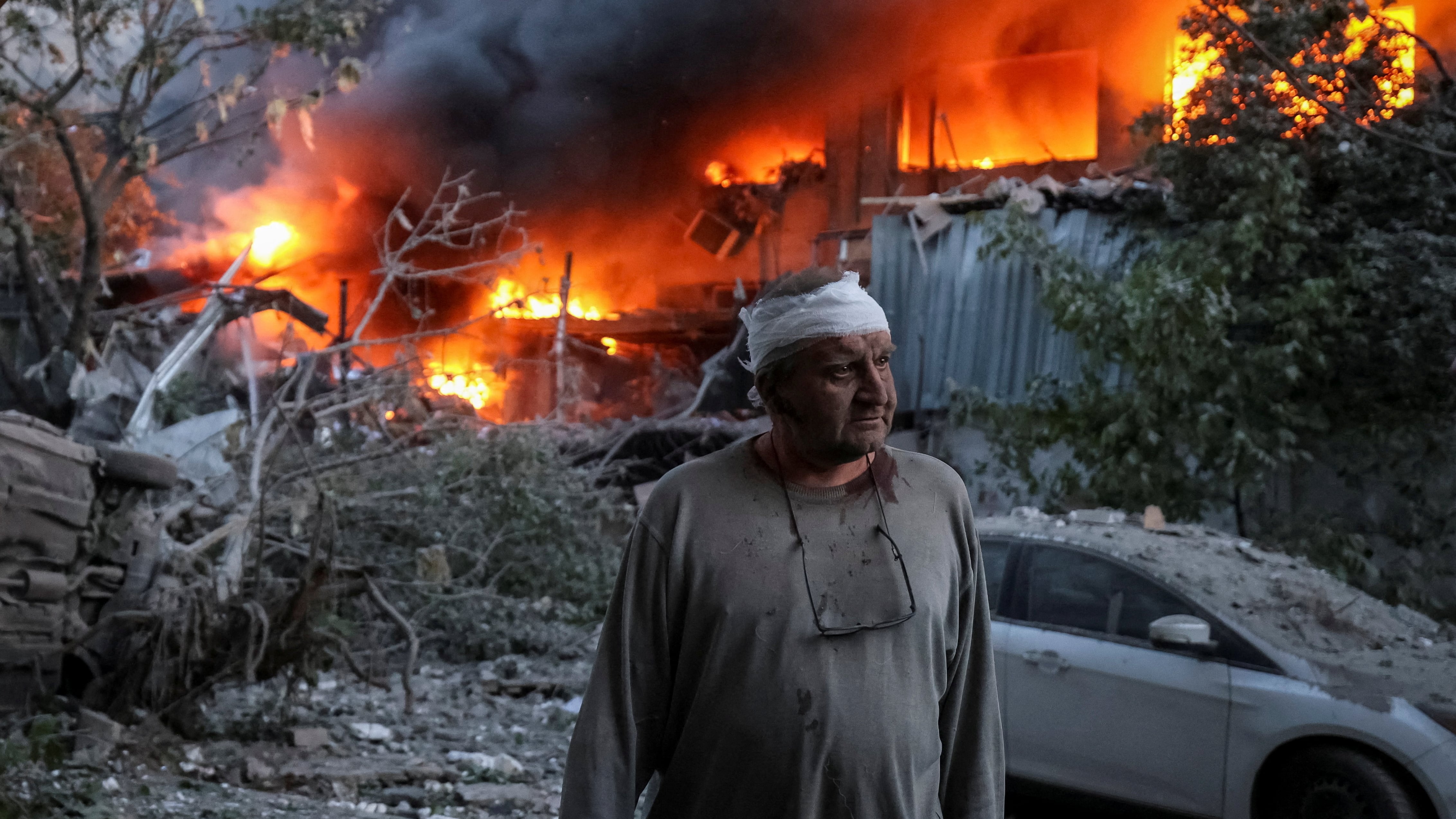 Residents trapped under rubble after Russian missile barrage on Kyiv