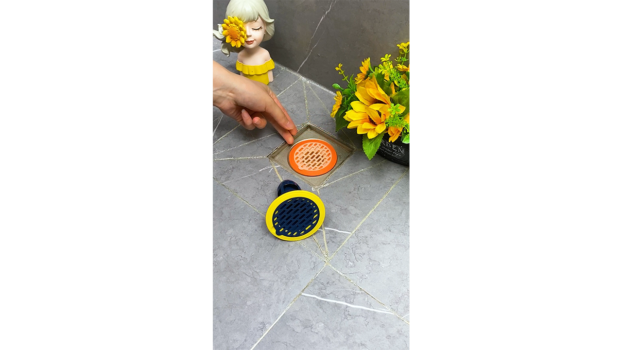 Installing floor drain core filter to block odors and pests resulting ...