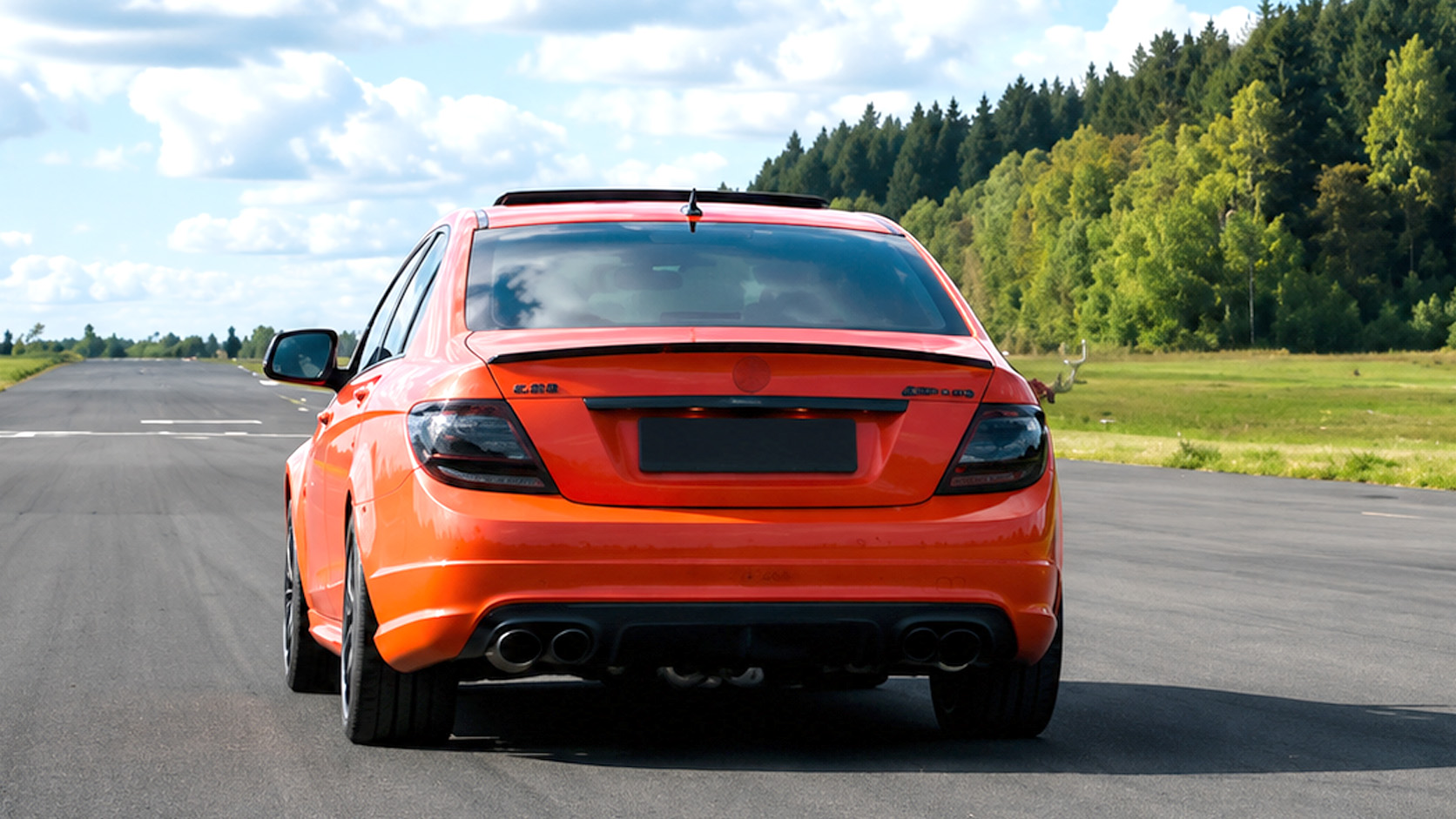 Mercedes C63 AMG shows custom exhaust sound in a drag race