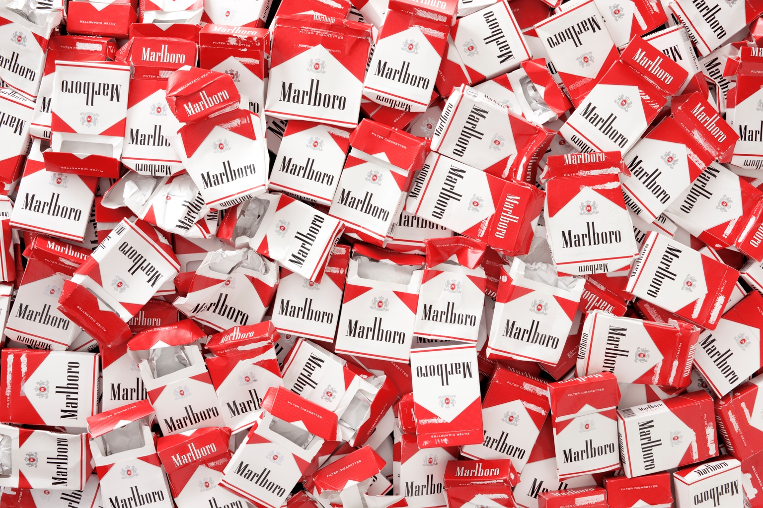 Philip Morris cuts full-year EPS outlook on $500M Canada impairment ...