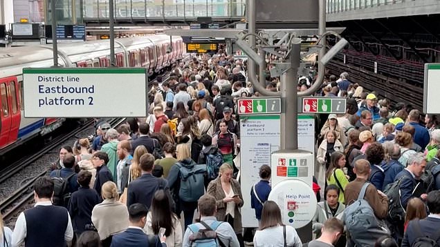 London commuters squeeze onto packed platforms amid tube strikes