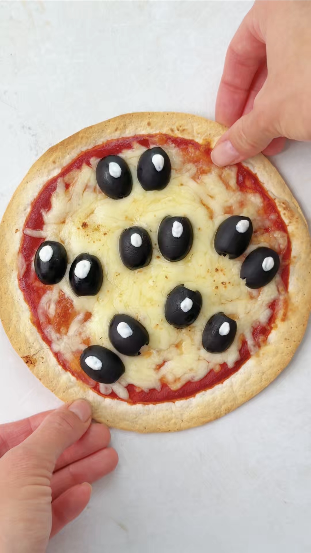Eye pizza, fun margherita pizza with olive eyes