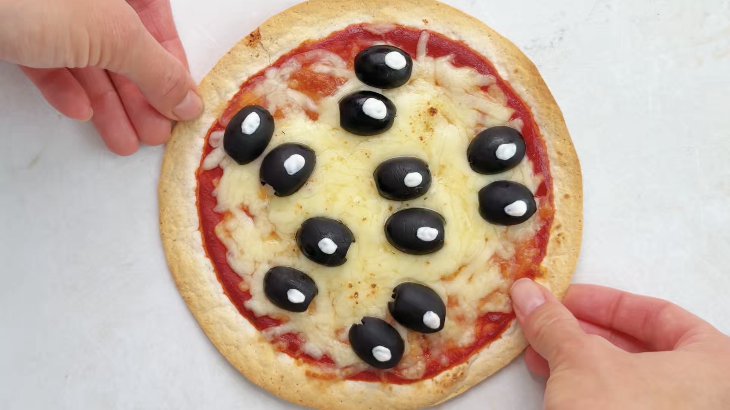 Eye pizza, fun margherita pizza with olive eyes