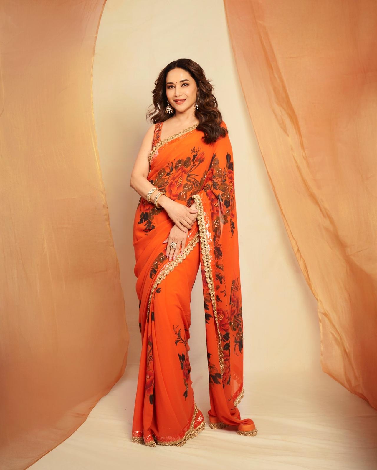 Maa Behen Madhuri Dixit embraces floral magic in breezy promotional looks