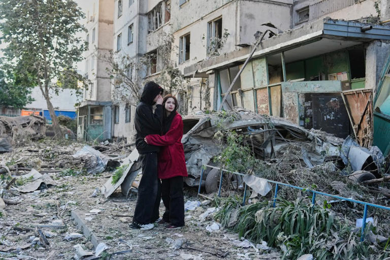 Russian attack on Ukraine kills at least 11 and traps others in damaged ...