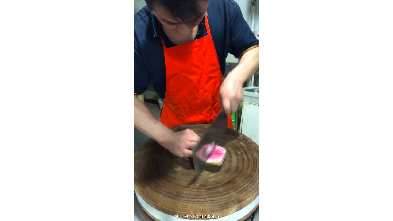 Chopping watermelon radish with sharp cleaver creating vibrant pink and ...