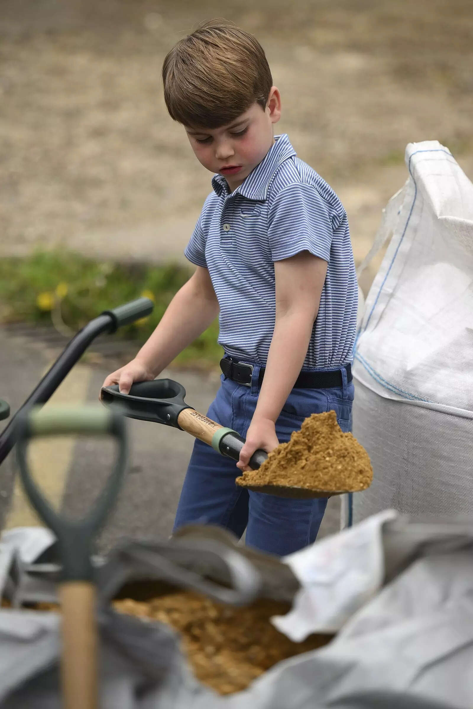 The sweet moment Prince Louis picked up a shovel for his first royal ...
