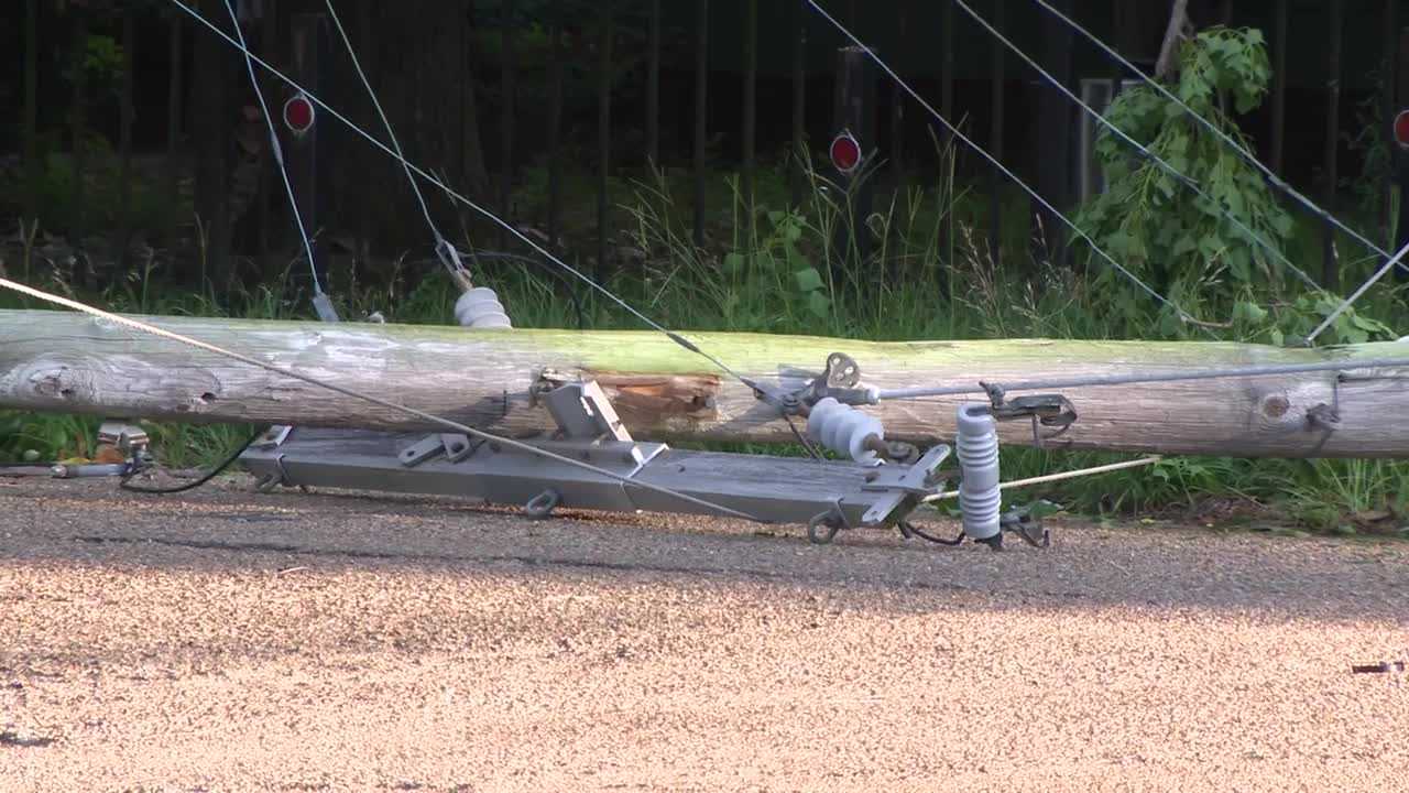Woman arrested after crash takes down three utility poles and power lines