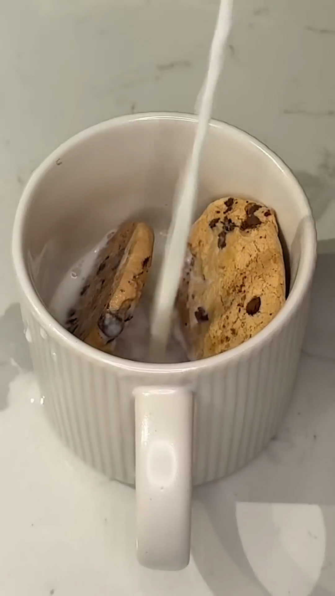 Single mug cake built around crushed chocolate chip cookies and milk