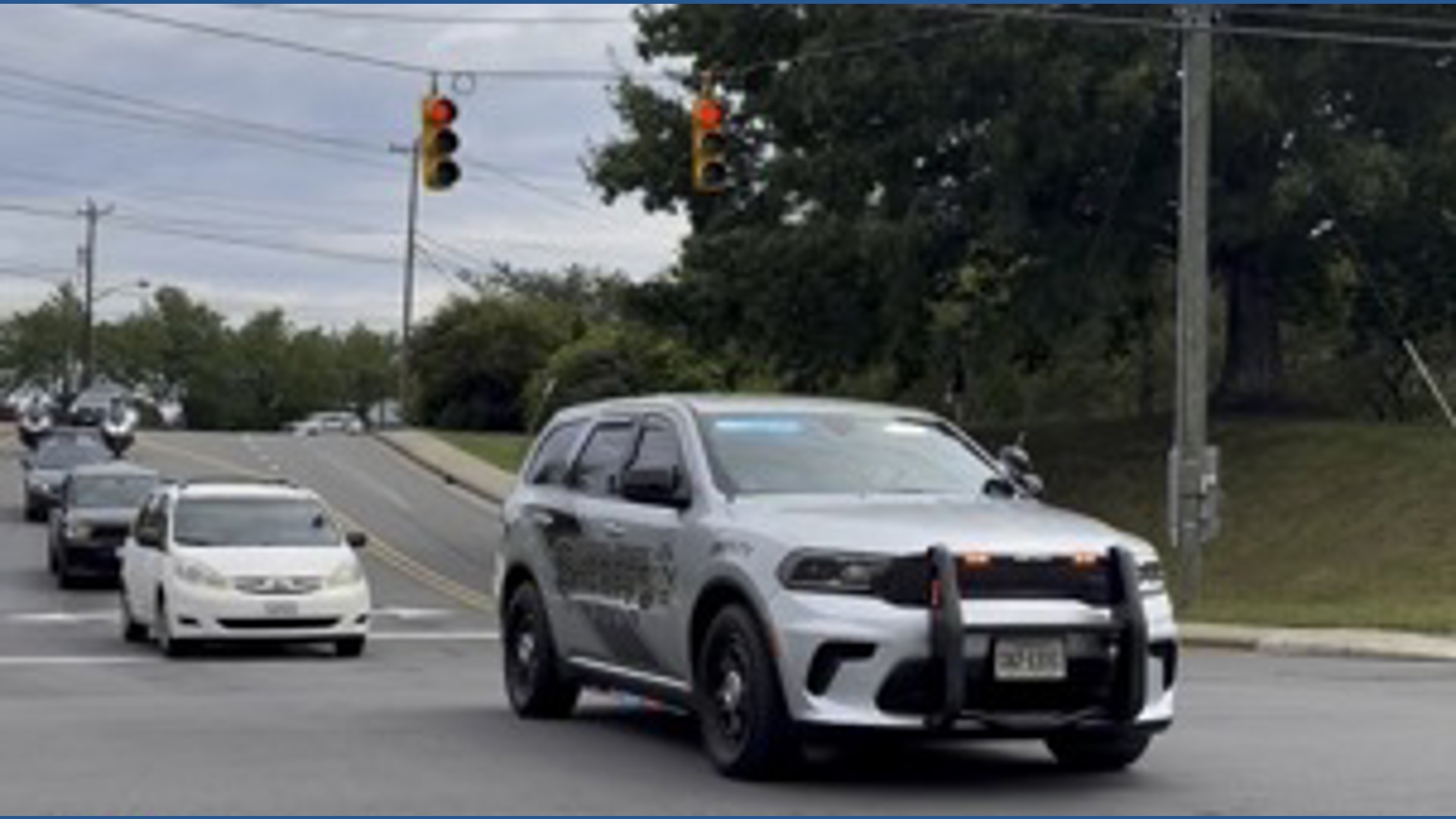 Hundreds gather to escort the body of Deputy Logan Utt