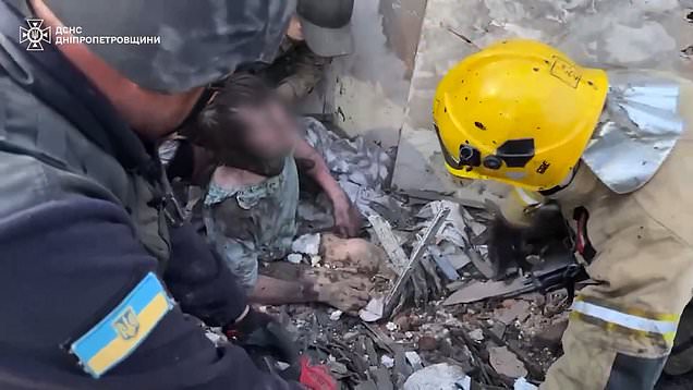 Ukrainian rescue crew pull woman alive from rubble after Russia ...