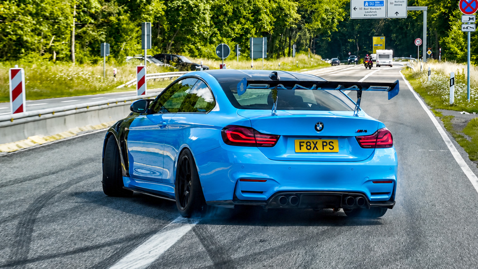 This BMW car meet exit turns into a slide-off moment