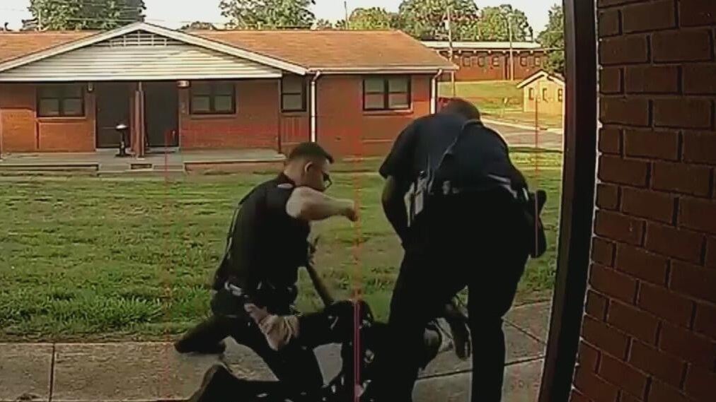 Police officer caught on video repeatedly punching woman in face