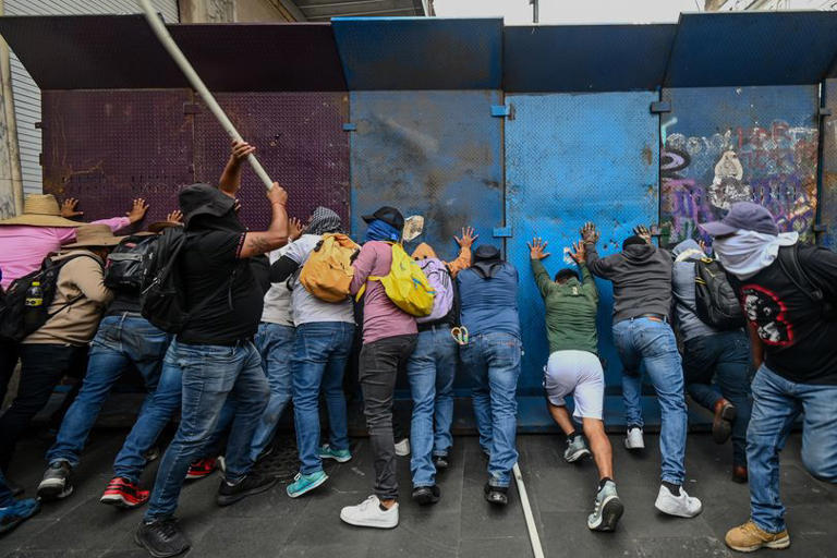 Mexican police tear-gas protesters in angry clash at World Cup fanzone site