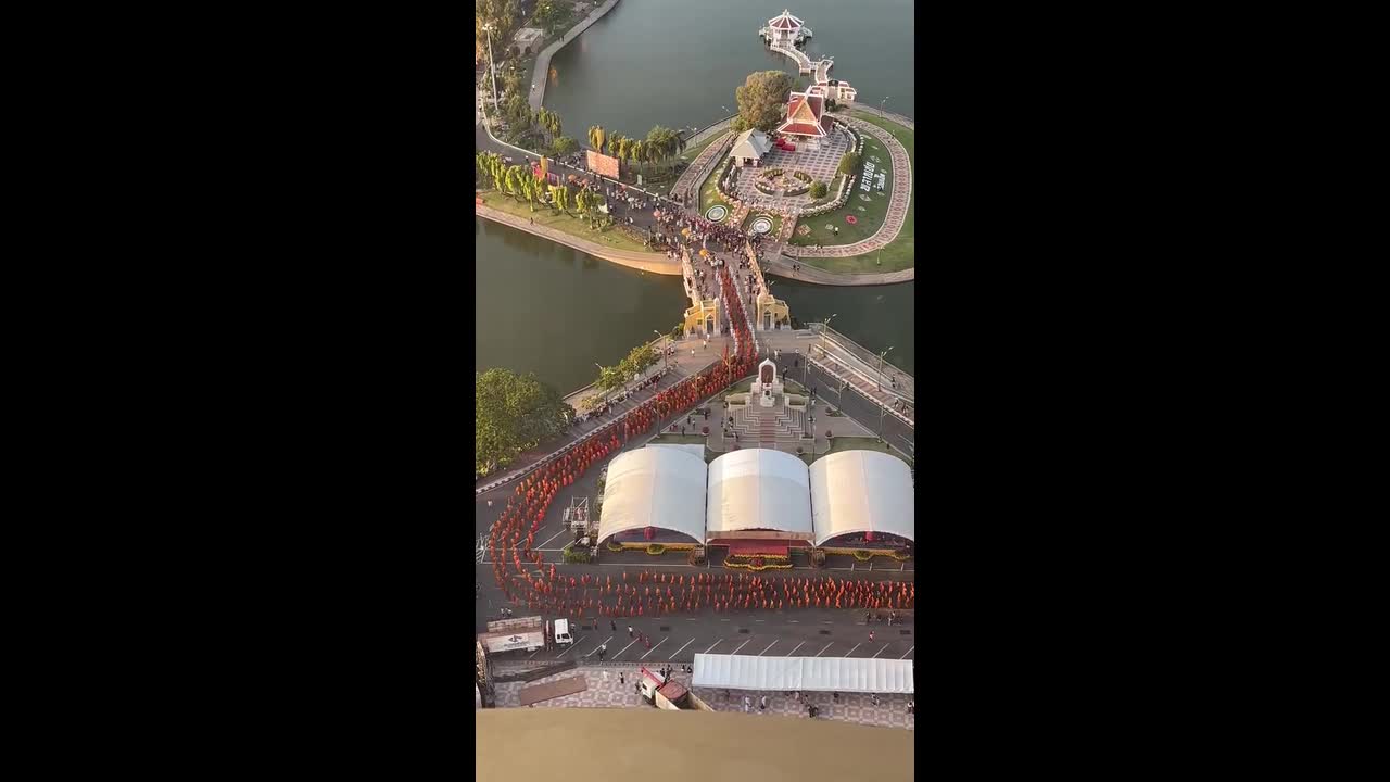 Hundreds of Buddhist monks walk in formation at festival