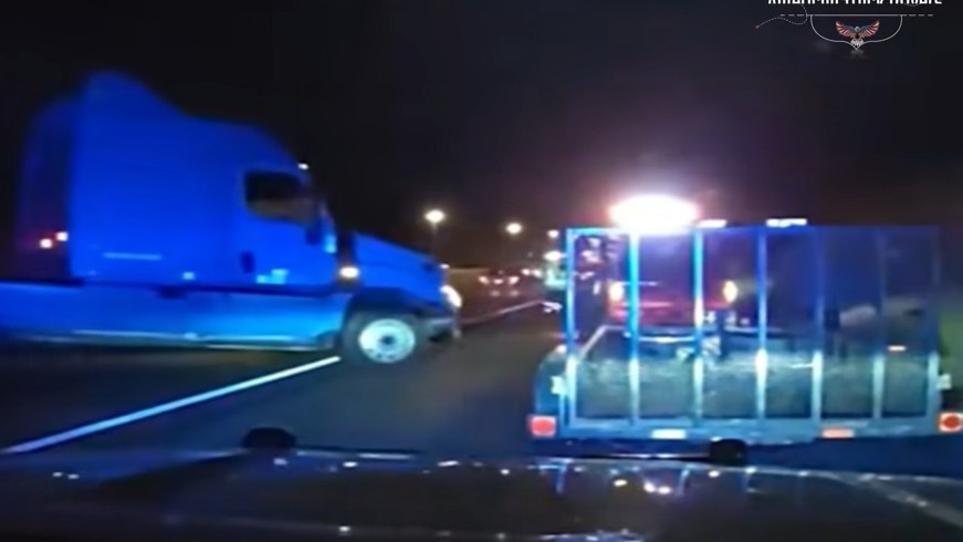 Truck slams car as police run - then the intersection turns into chaos