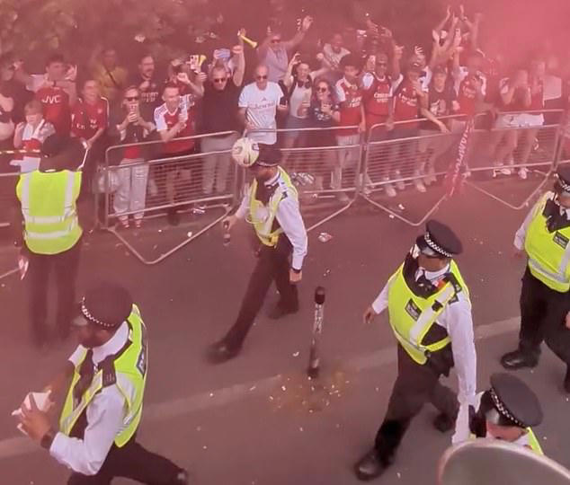 Moment Martin Odegaard hits police officer on head with football from ...