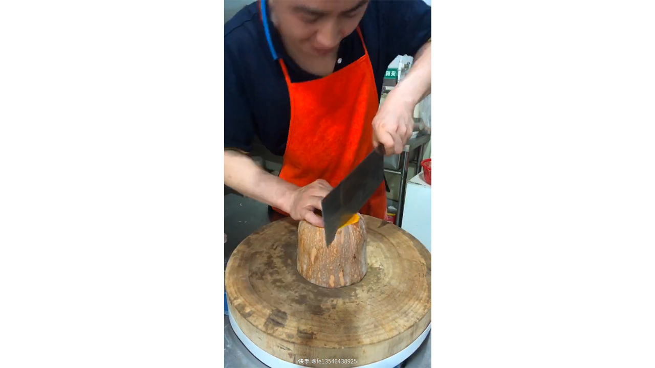Slicing thick pumpkin into perfect segments with sharp cleaver creating ...