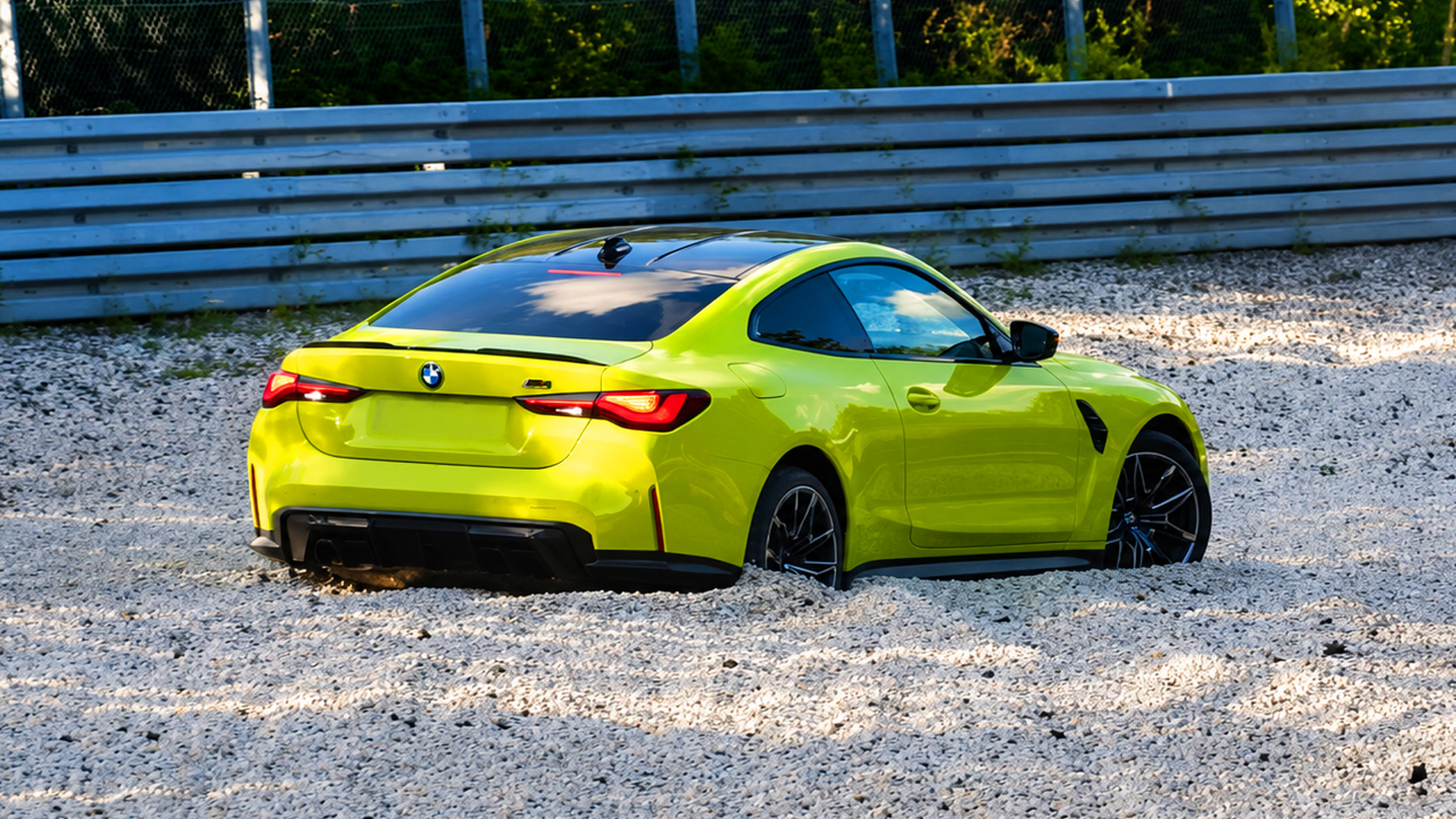 BMW driver gets stuck in gravel after a dangerous off-track moment