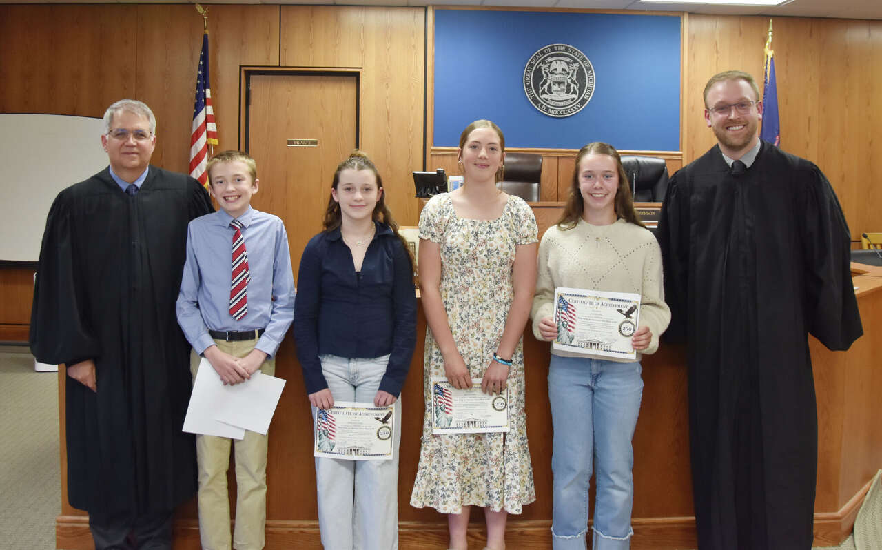 Students present winning essays in court contest