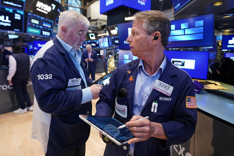 A drop for Alphabet helps slow Wall Street's record-breaking rally