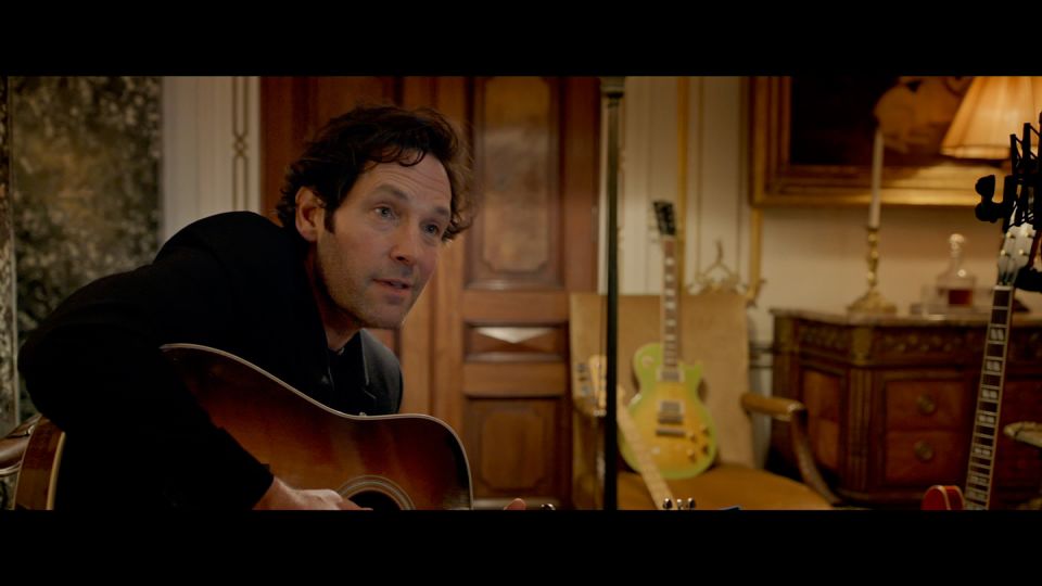 A fictional pop star steals a song from a wedding band singer in 'Power ...