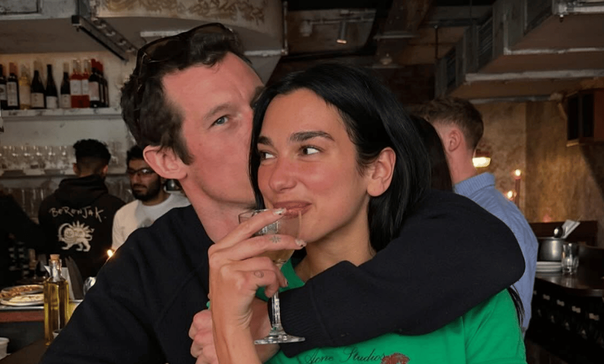 Dua Lipa passionately kisses Callum Turner in wedding snaps