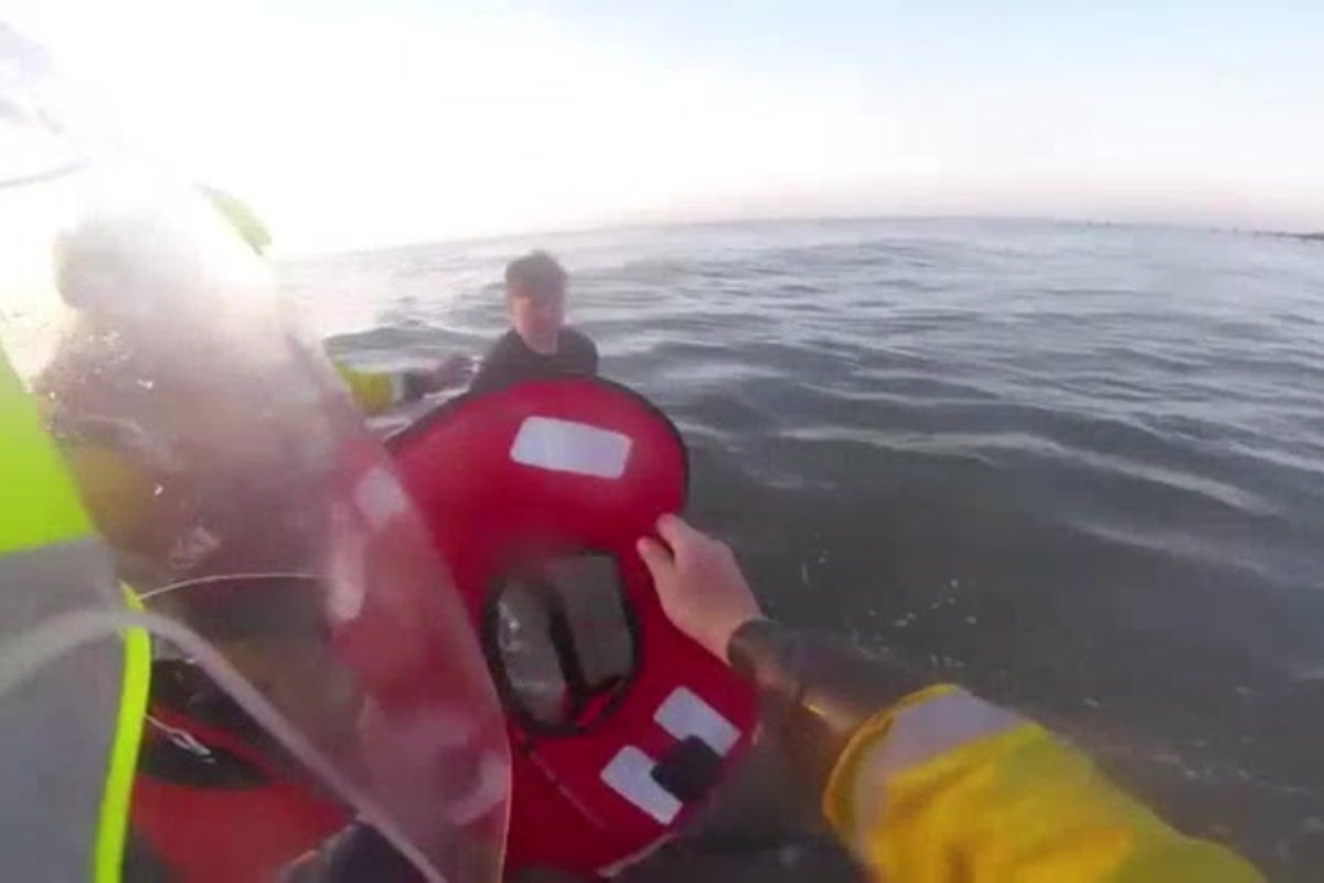 Beachgoer trapped in sand as tide comes in rescued just in time