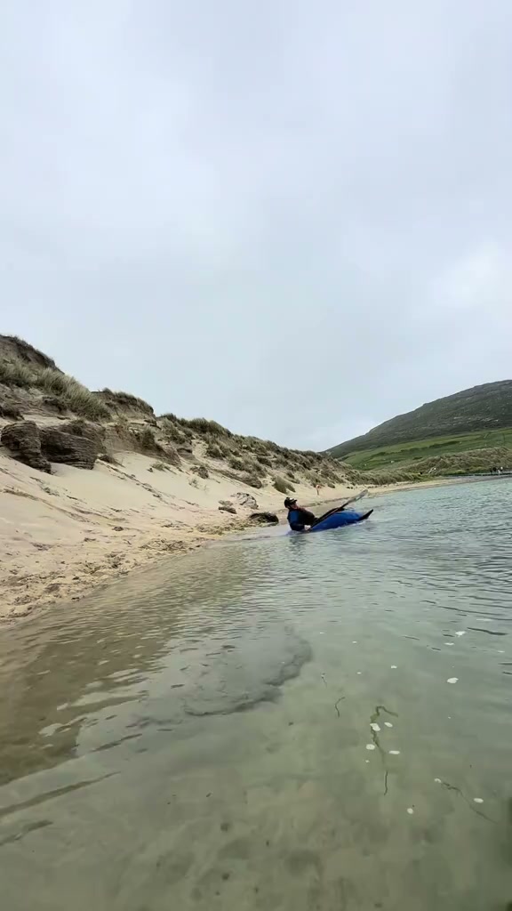 Kayak sand dune drop ends in a rough beach landing