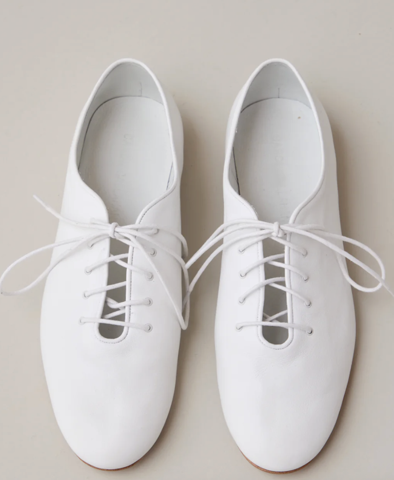 An anti-tennis shoe trend scores Lily Collins's 2026 French Open ...