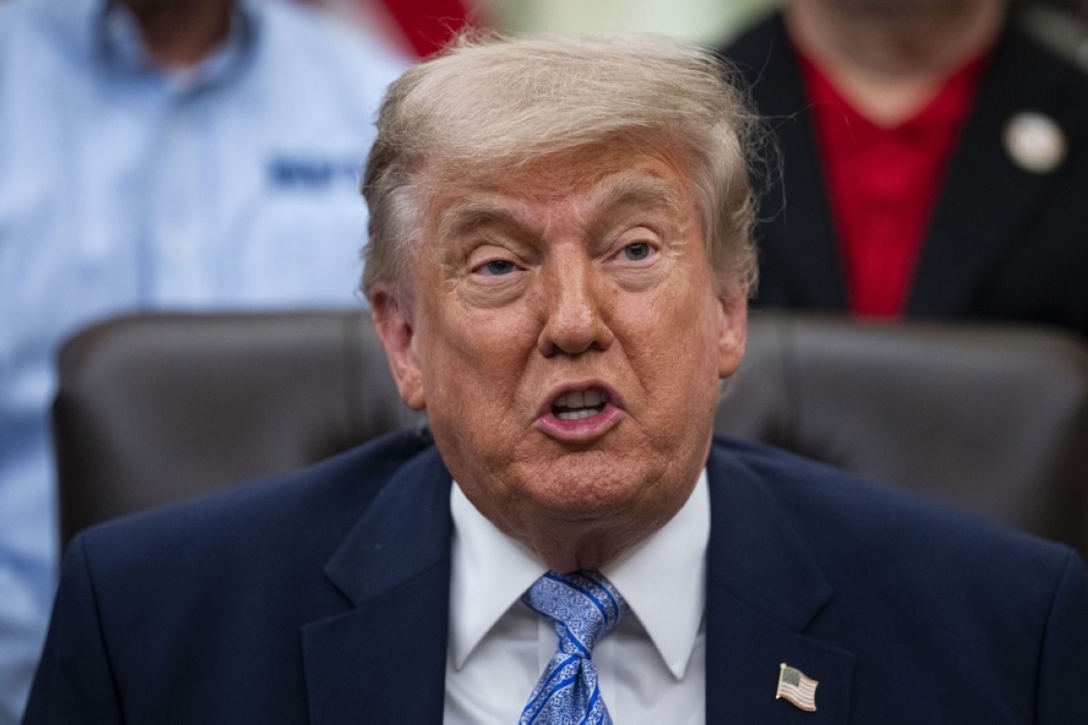 Trump says Iran talks moving fast despite threat to widen war
