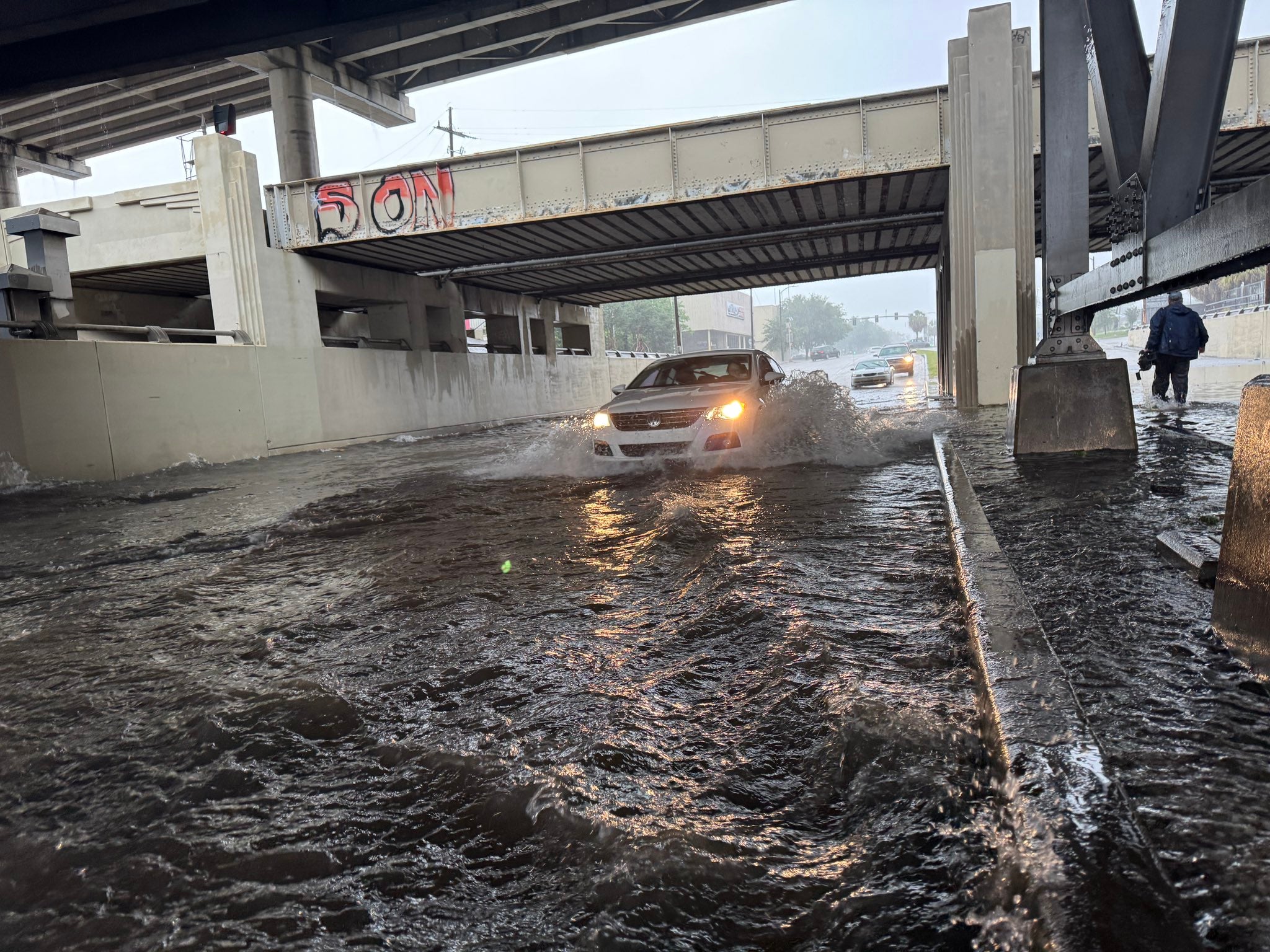 Slow-moving system to bring tropical downpours, rough surf and strong ...