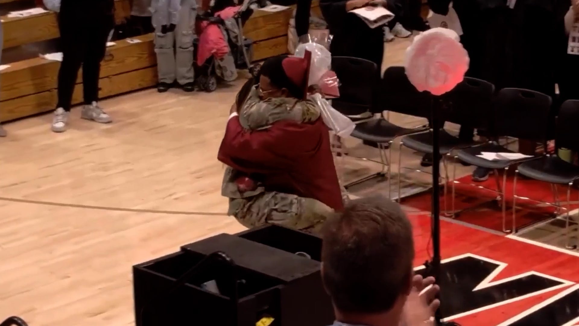 From deployment to diploma day, watch a sister’s surprise steal the show