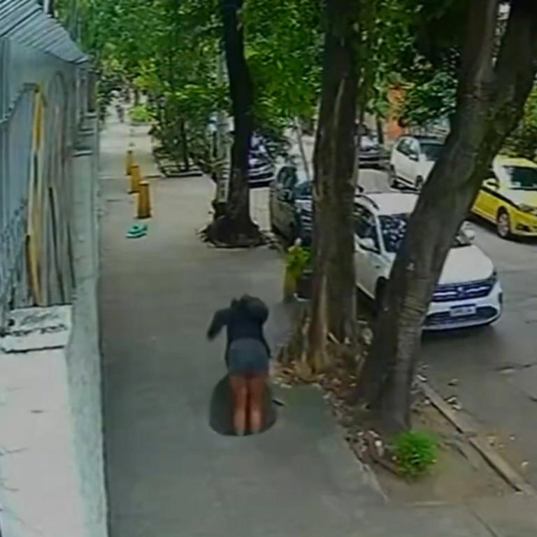 Terrifying moment woman falls down a manhole after cover gives way ...