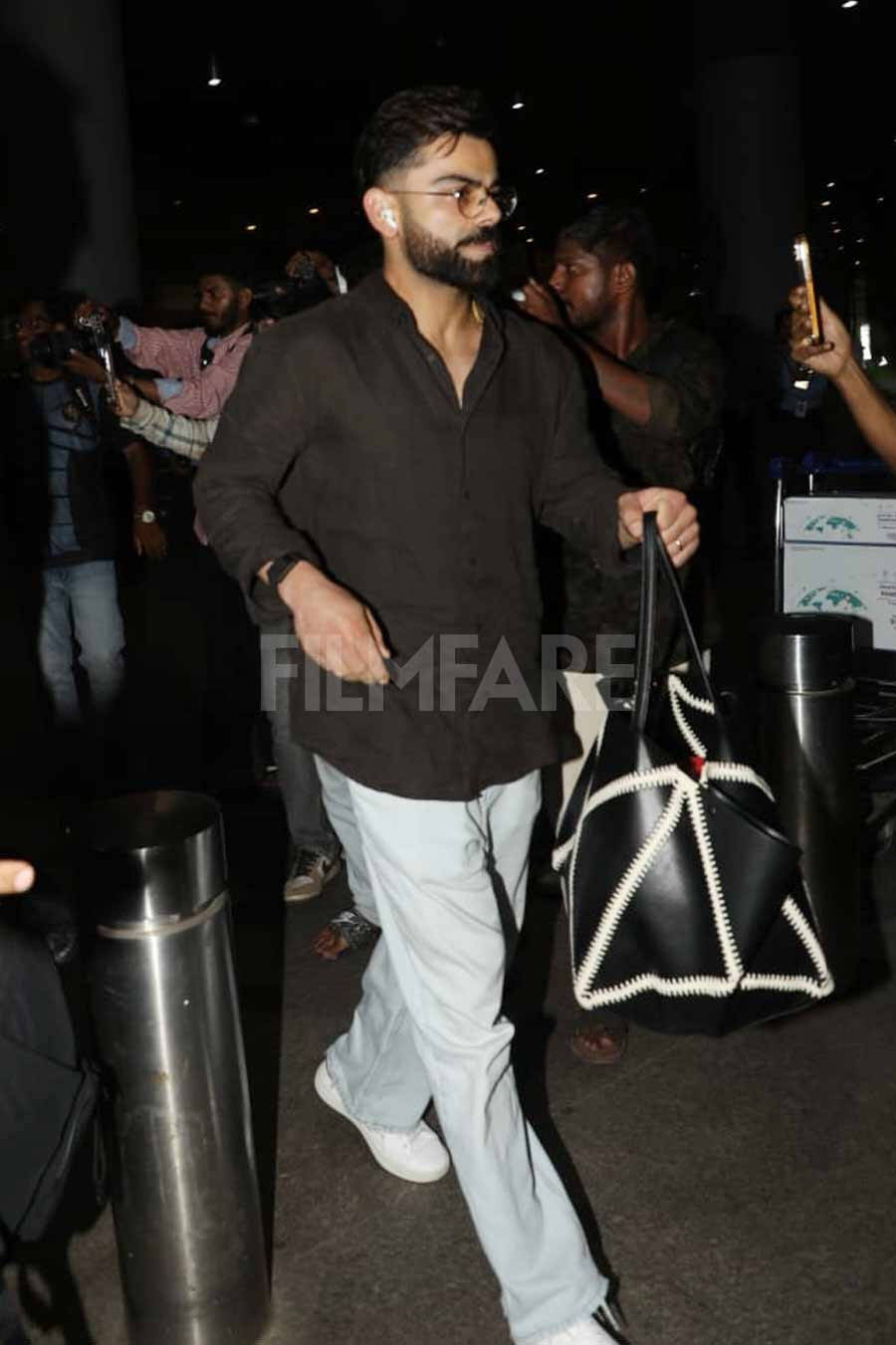 Photos: Virat Kohli and Anushka Sharma return to Mumbai after Vrindavan ...