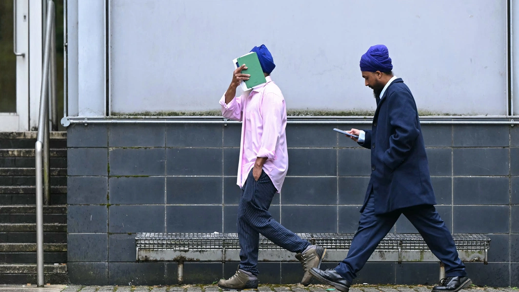 Convicted killer and family face 22 weapons charges