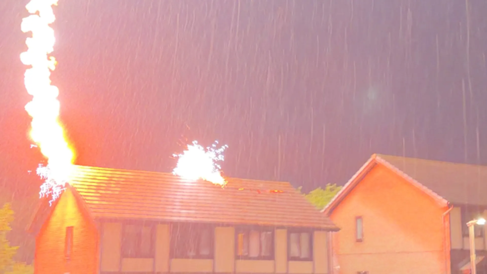Moment lightning bolt strikes roof sparking huge blaze
