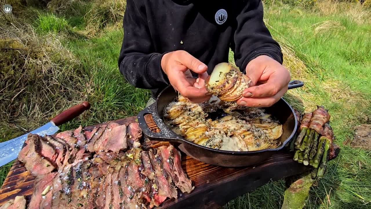 Watch how garlic butter steak and campfire potatoes come together outdoors