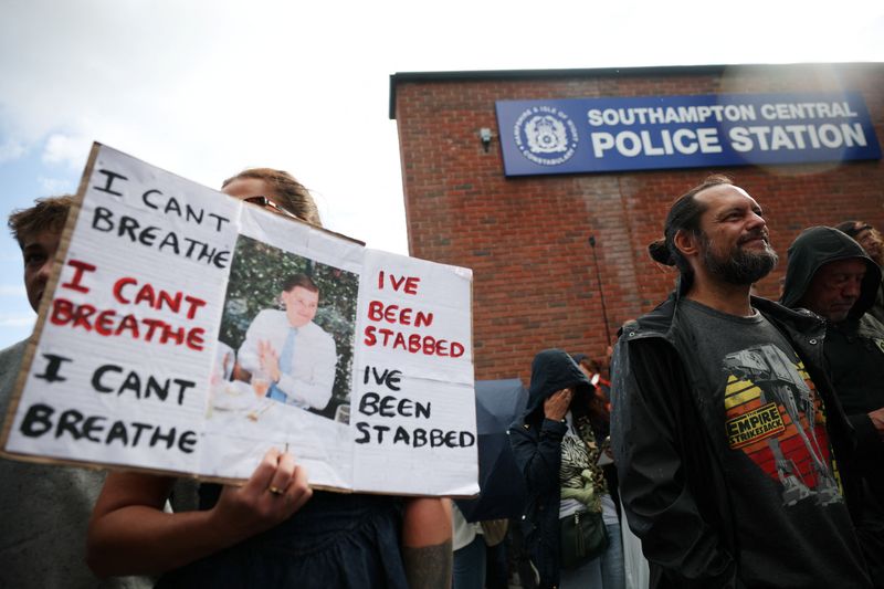 UK police under pressure after dying student was handcuffed