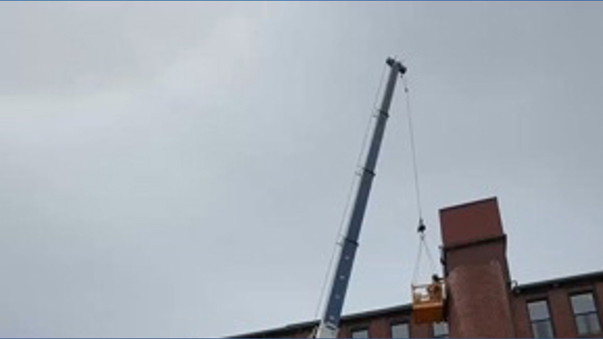 Mill smokestack comes down