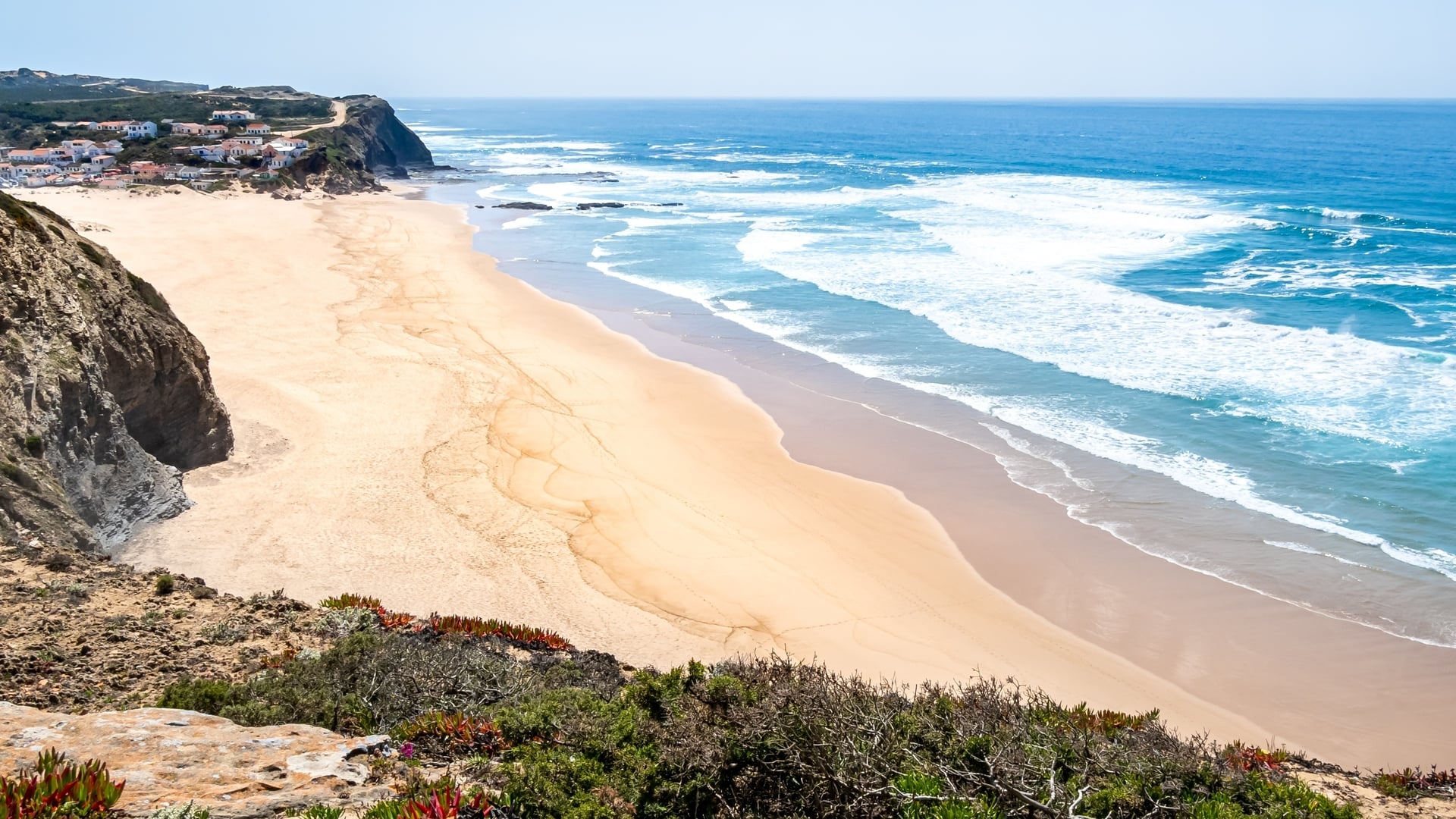 In Portugal, this beach nestled between cliffs and the Atlantic Ocean ...